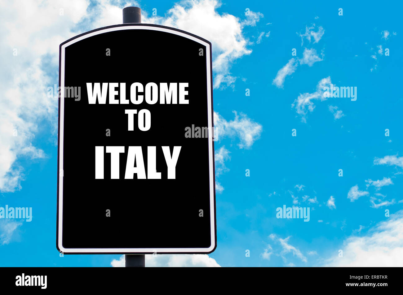 Black road sign with greeting message WELCOME TO ITALY isolated over ...