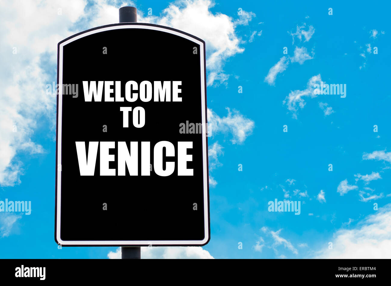 Black road sign with greeting message WELCOME TO VENICE isolated over ...