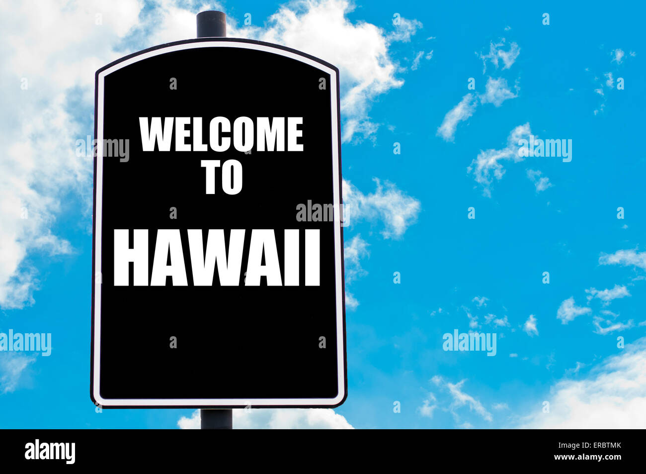 Black road sign with greeting message WELCOME TO HAWAII isolated over ...