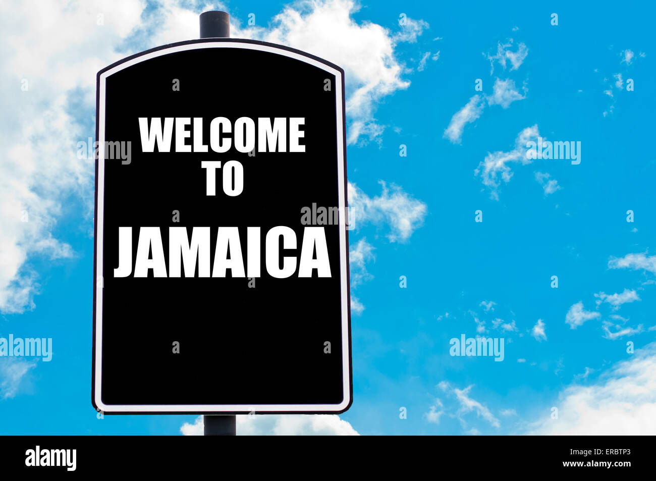 Black road sign with greeting message WELCOME TO JAMAICA isolated over ...