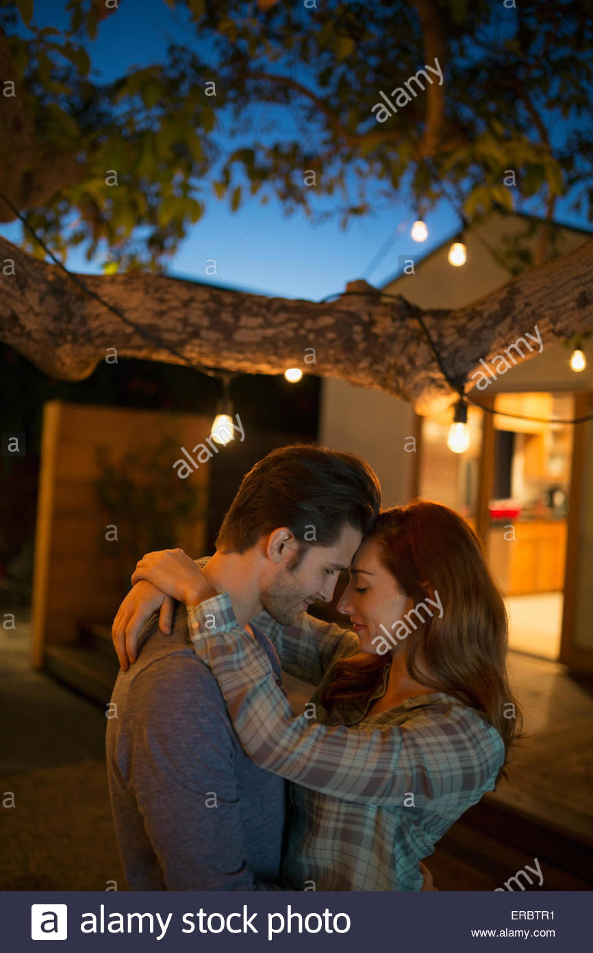 Young people hugging tree hi-res stock photography and images - Alamy
