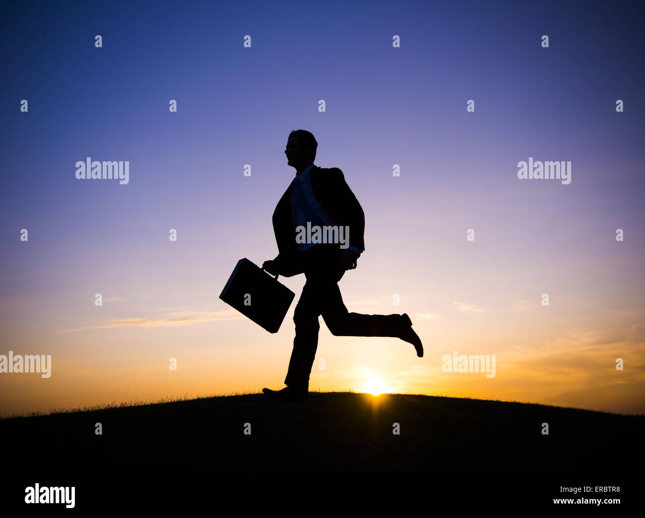 Man running in suit silhouette hi-res stock photography and images - Alamy