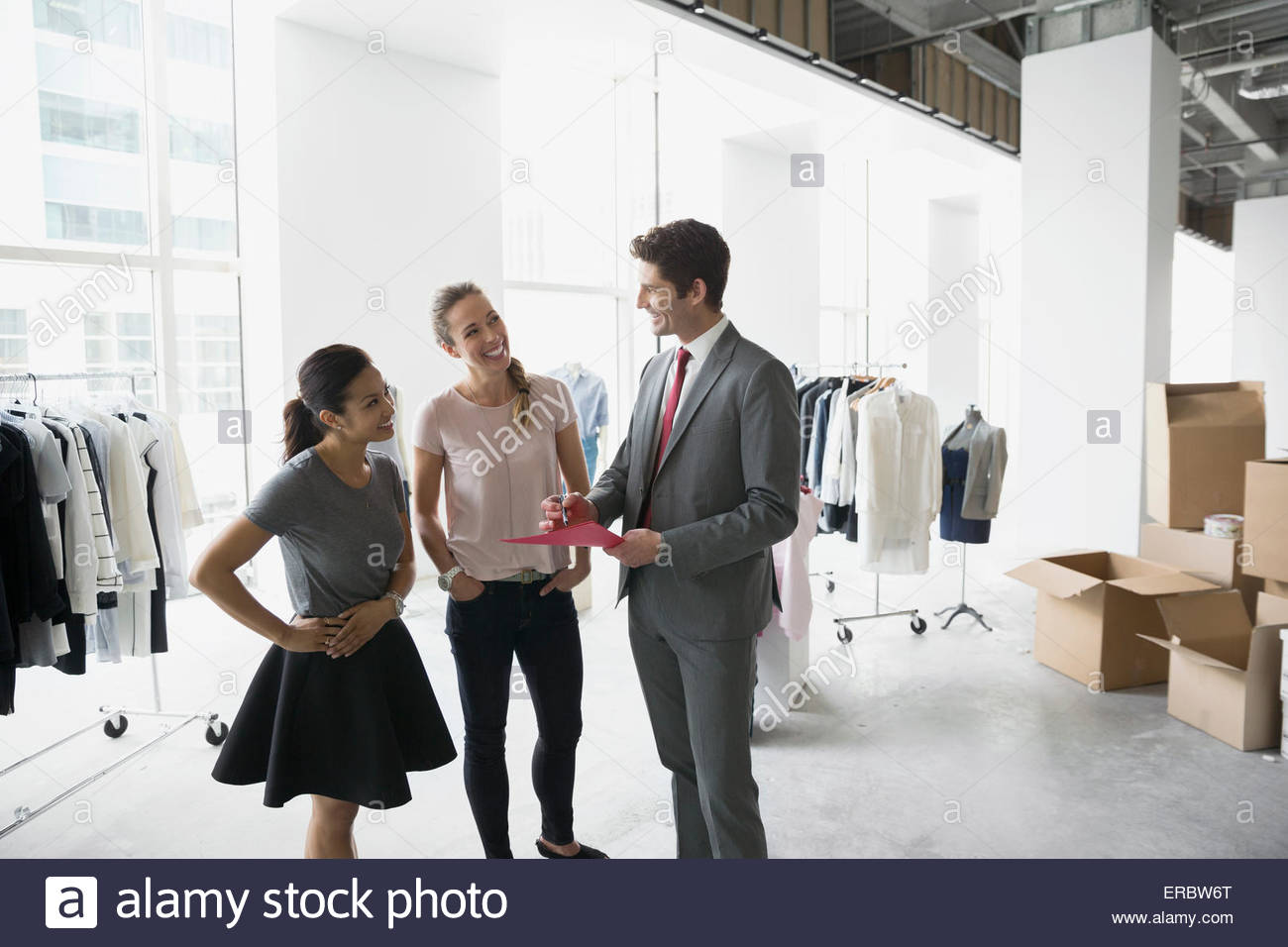 Fashion stylists and businessman meeting in studio Stock Photo - Alamy
