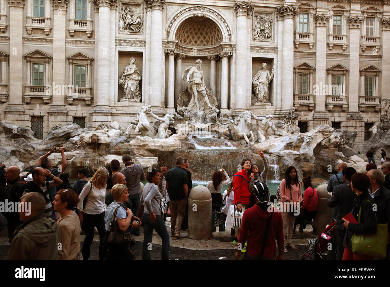 Tourists gathering around the Trevi Fountain in Rome Italy Stock Photo ...
