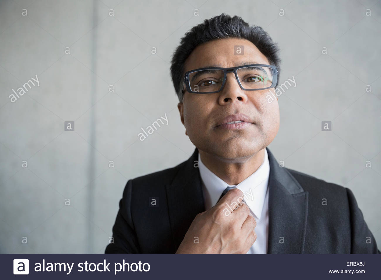 Adjusting tie hi-res stock photography and images - Alamy