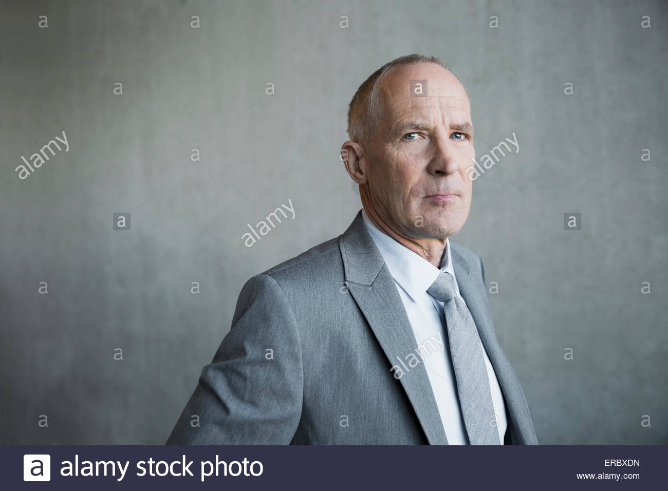 Portrait serious businessman with gray hair in suit Stock Photo - Alamy
