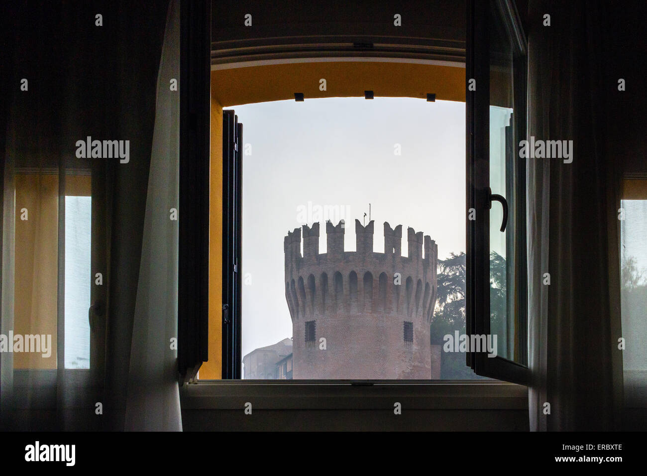window overlooking medieval tower in the fog in Lugo near Ravenna in ...