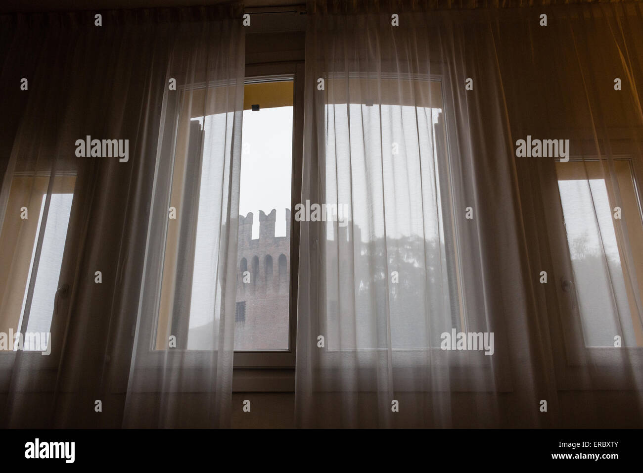 window overlooking medieval tower in the fog in Lugo near Ravenna in ...