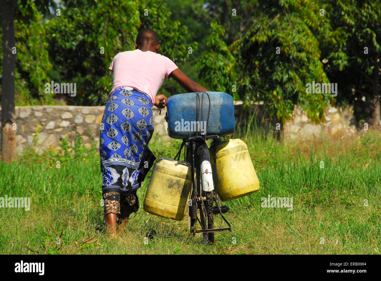 African delivers water Stock Photo - Alamy