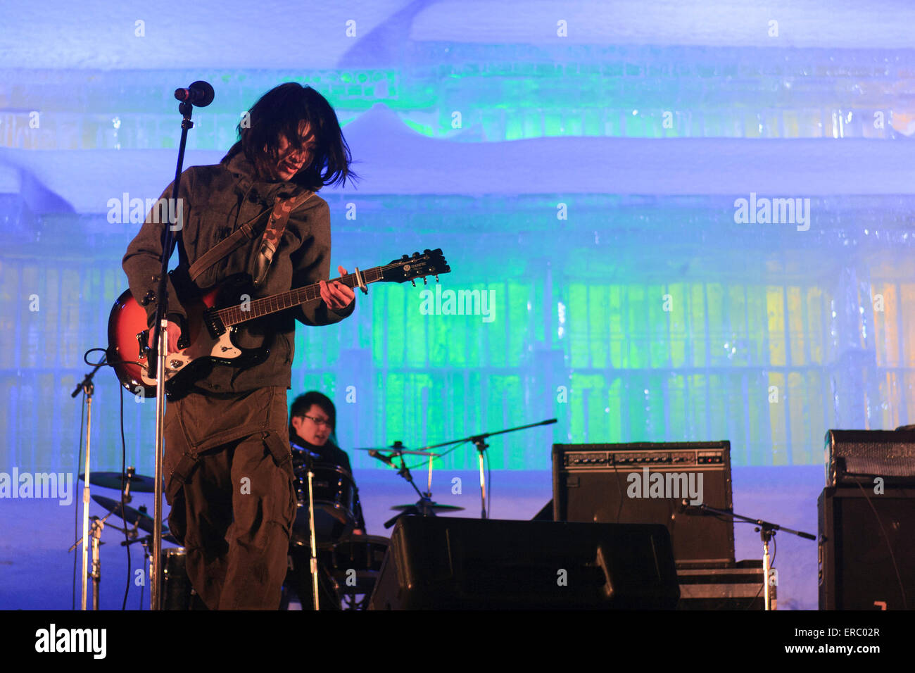A Japanese rock band performs at the foot of a giant illuminated snow ...