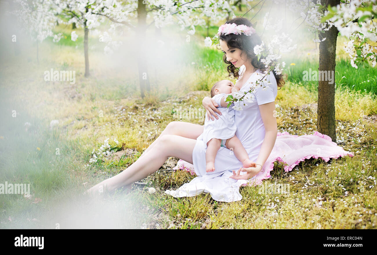Calm mother feeding her beloved baby Stock Photo - Alamy