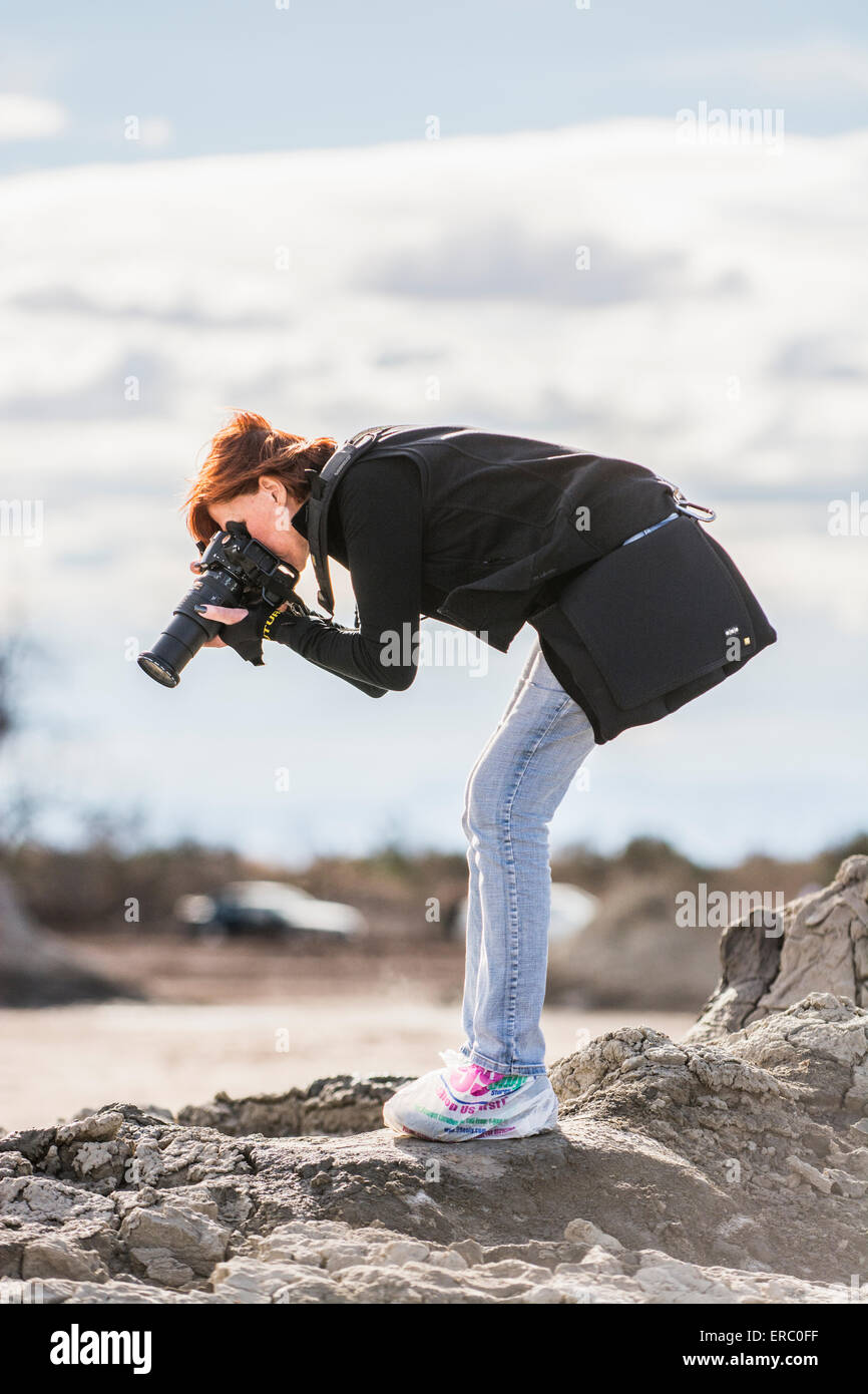 A photographer photographing a rock formation off Highway 395 ...