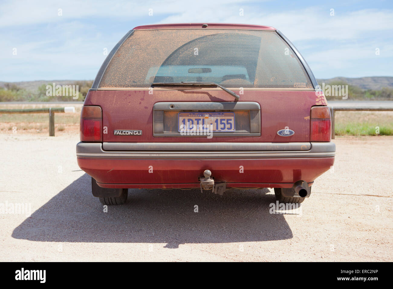 Rear view of an Australian Ford Falcon Wagon covered in dust from ...