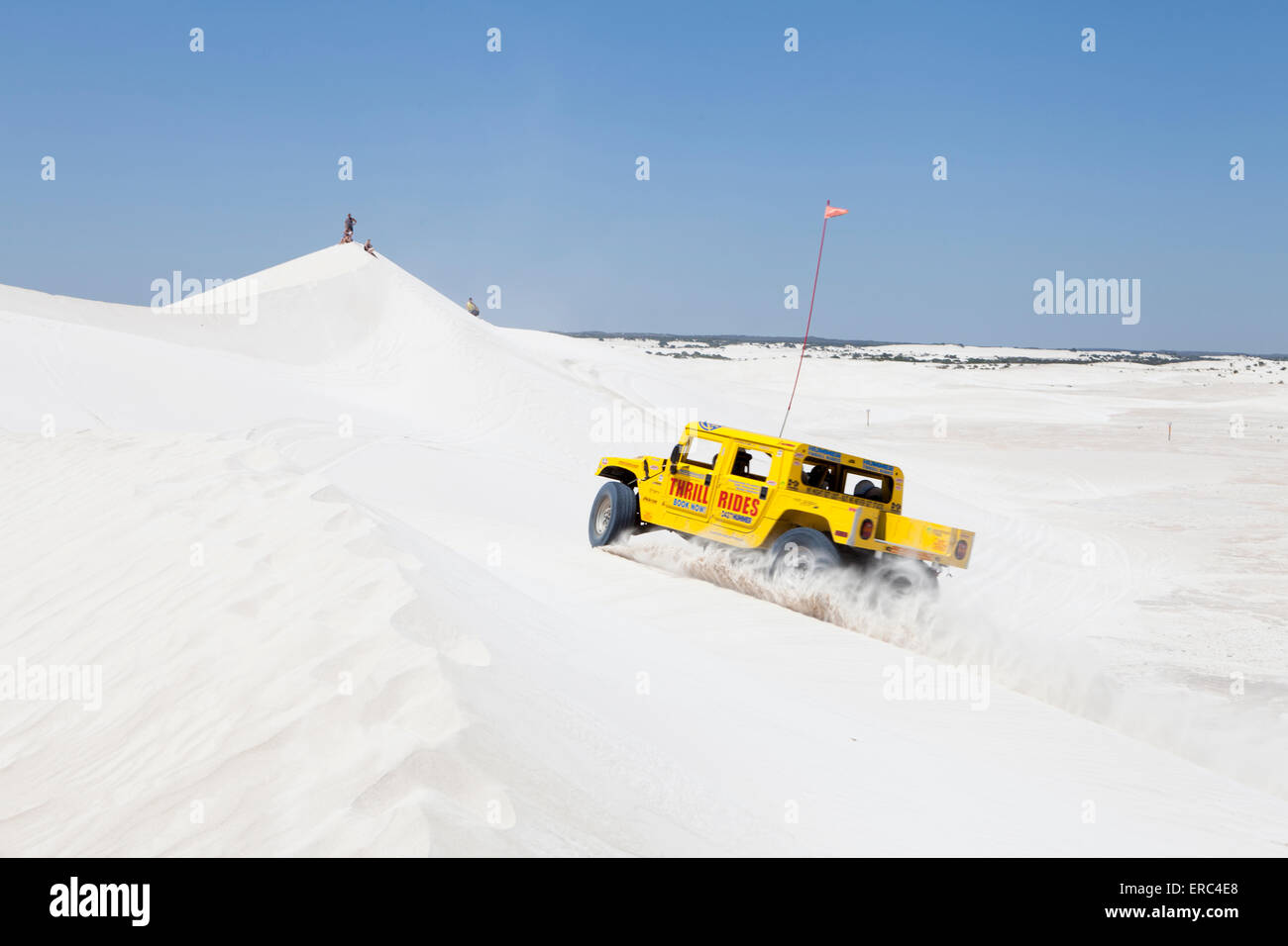 Bright yellow Hummer racing through Lancelin sand dunes, Western ...