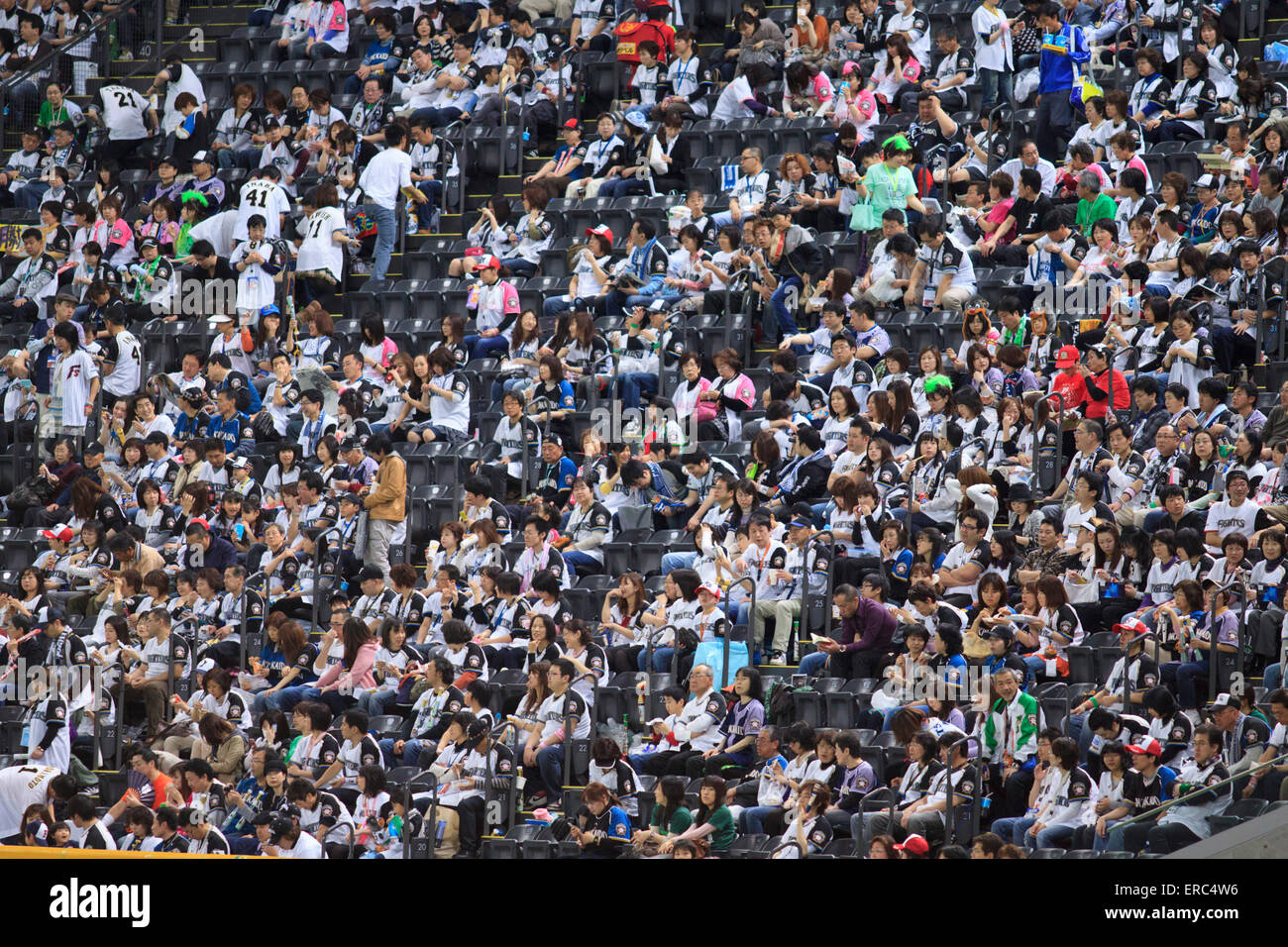 A giant crowd of people at the Sapporo Dome in Sapporo, Hokkaido gather ...