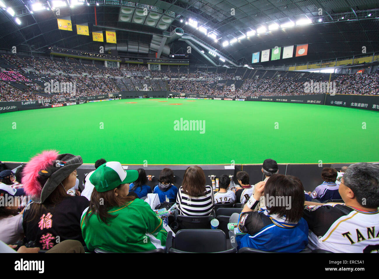 A giant crowd of people at the Sapporo Dome in Sapporo, Hokkaido gather ...