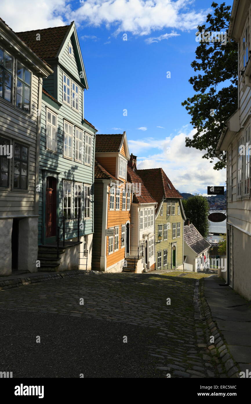 A cobbled lane with old timber buildings in the open-air museum, Gamle ...
