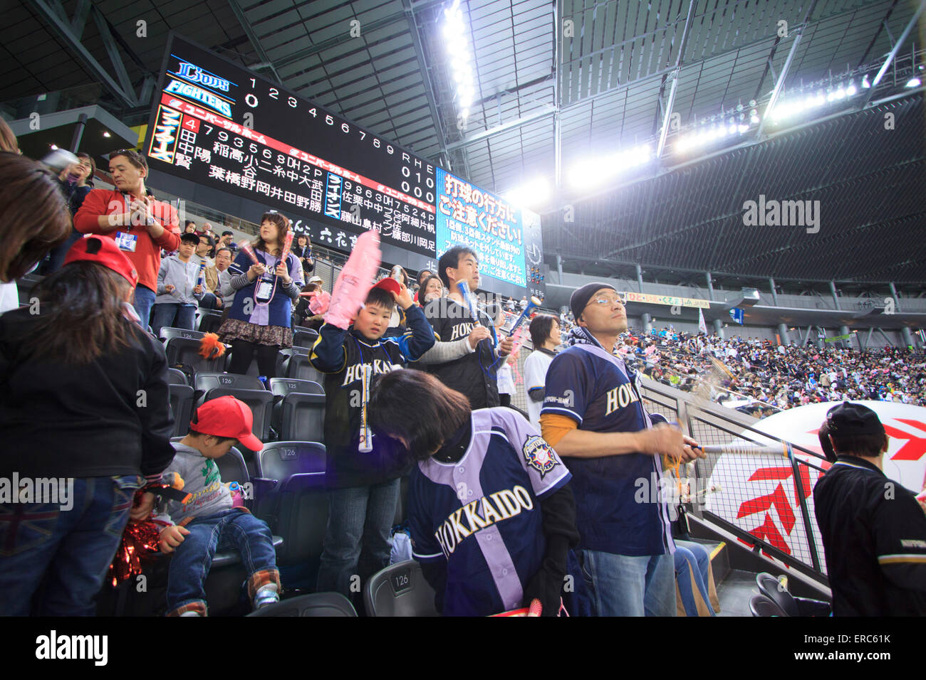 A giant crowd of people at the Sapporo Dome in Sapporo, Hokkaido gather ...