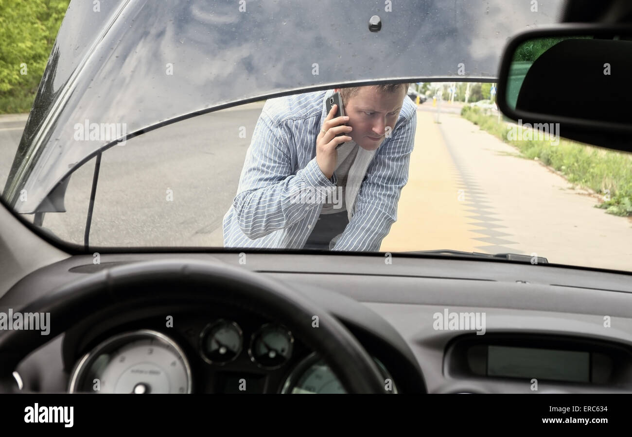 Broken car - a man calling for help Stock Photo - Alamy