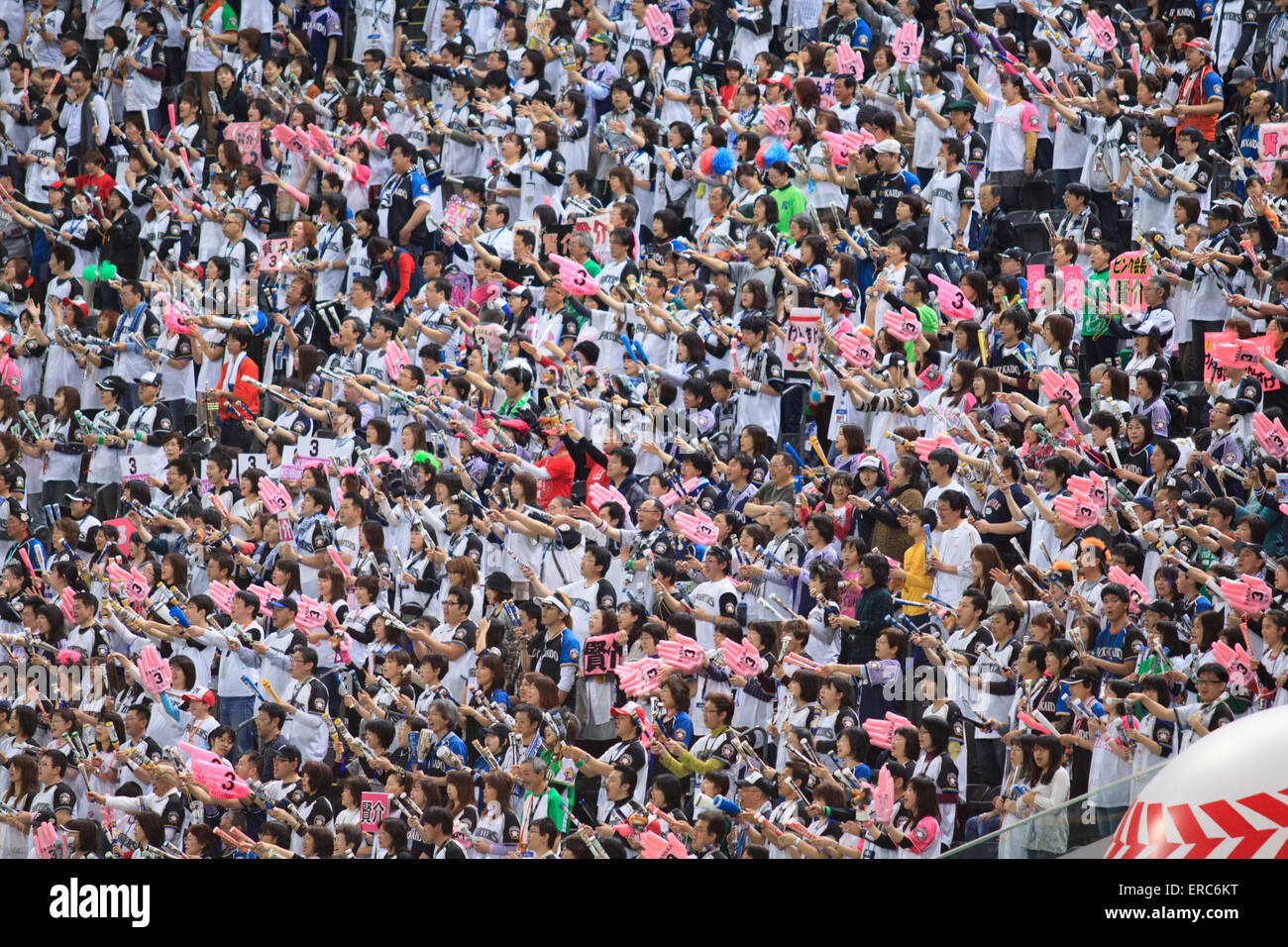 A giant crowd of people at the Sapporo Dome in Sapporo, Hokkaido gather ...