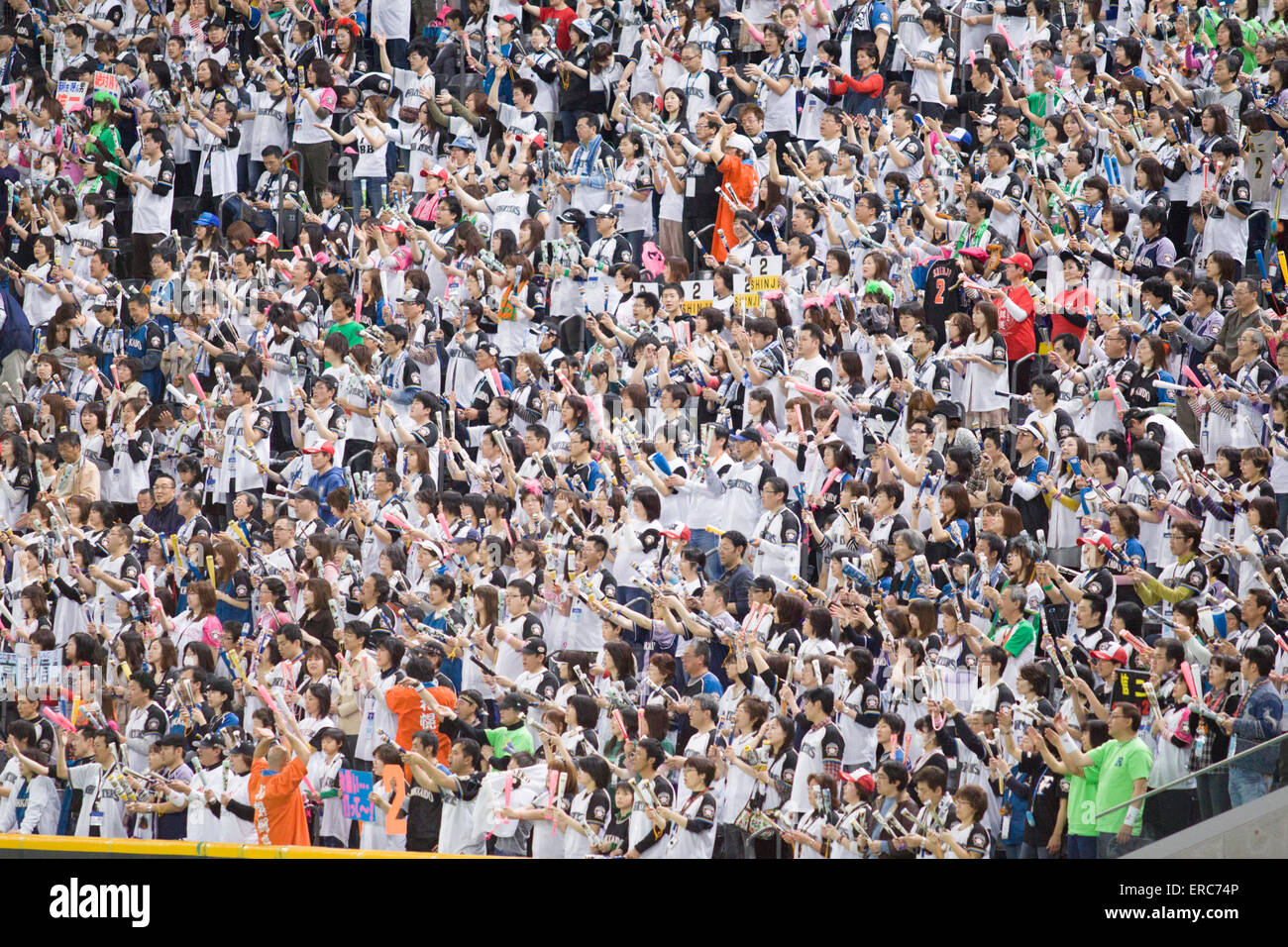 A giant crowd of people at the Sapporo Dome in Sapporo, Hokkaido gather ...