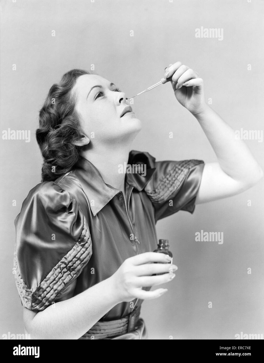 Eye drops woman Black and White Stock Photos & Images - Alamy