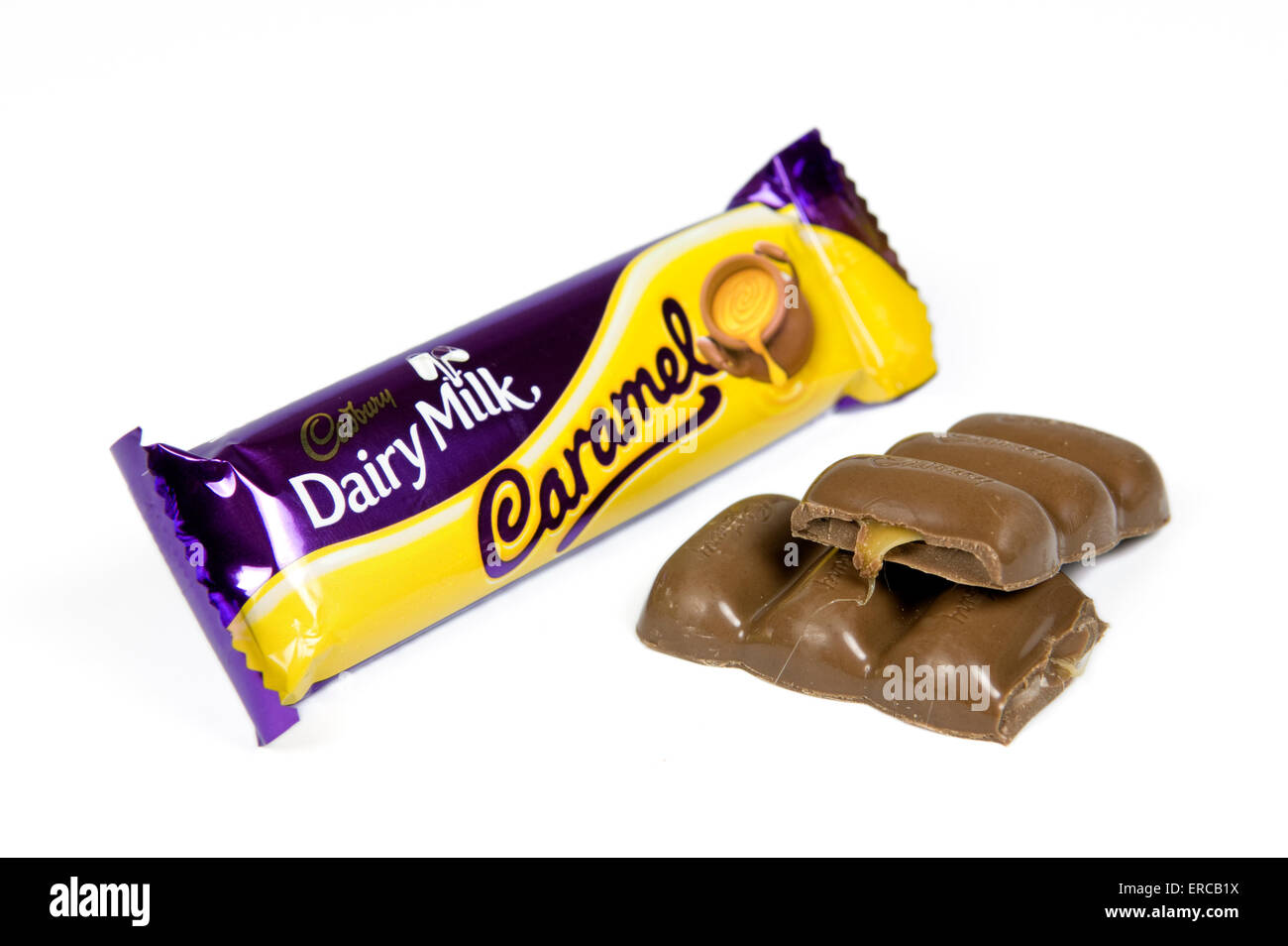 Caramel chocolate bar on white background with open cut up bar by the ...