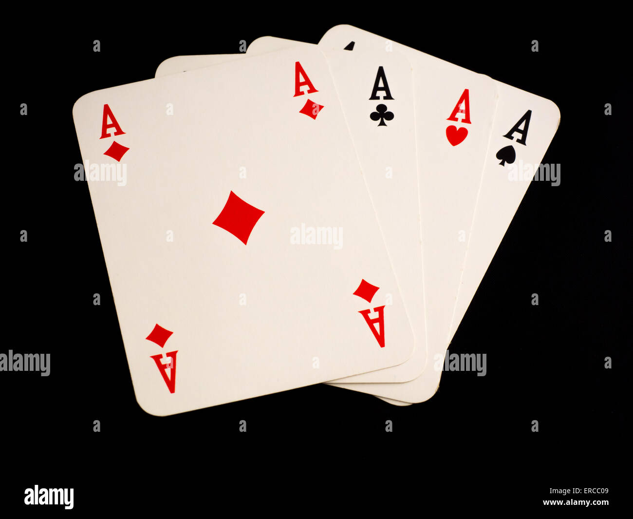 Four aces on black background Stock Photo - Alamy