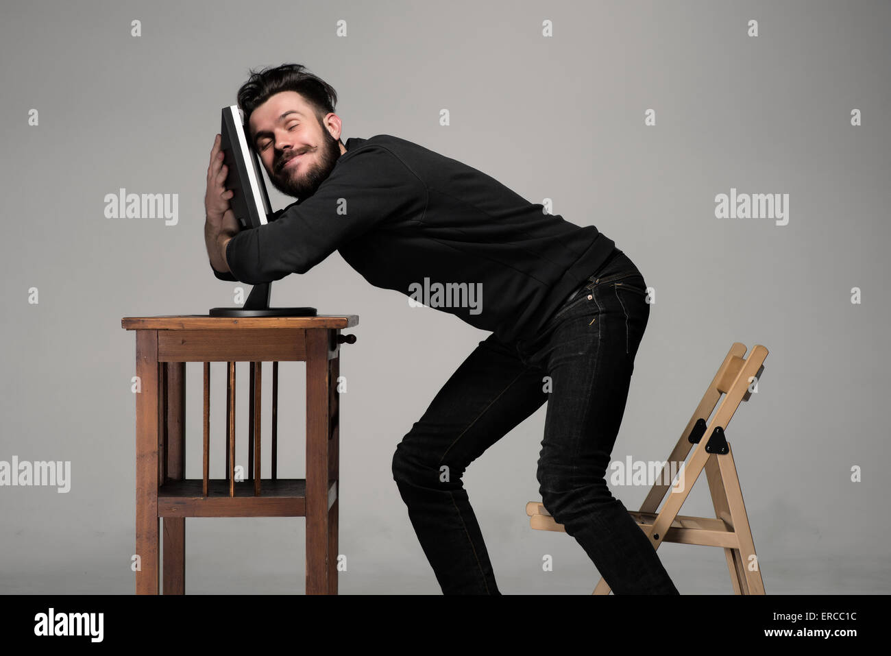 Funny and crazy man using a computer Stock Photo - Alamy