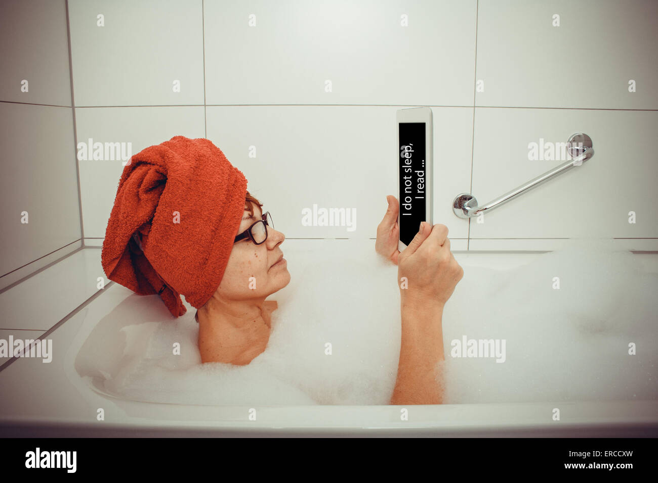 Woman in bathtub with tablet computers, space for text, retro style ...