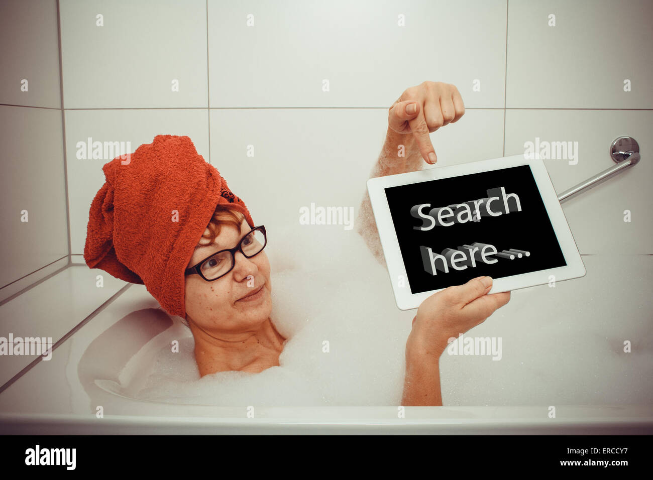 Woman in bathtub with tablet computers, space for text, retro style ...