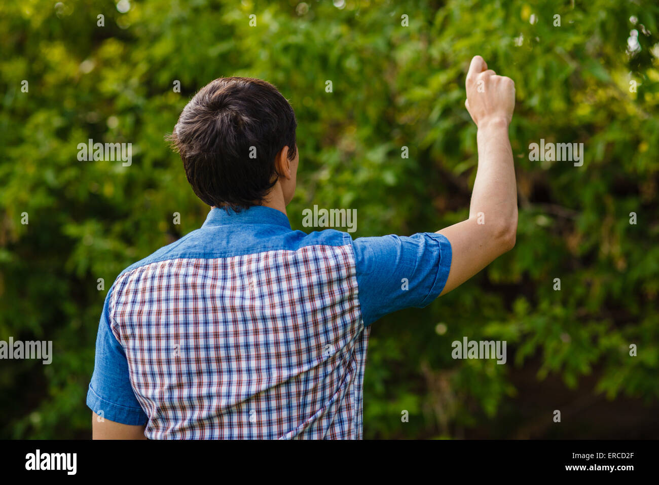 man back writing hand in the air on a green background street tr Stock ...