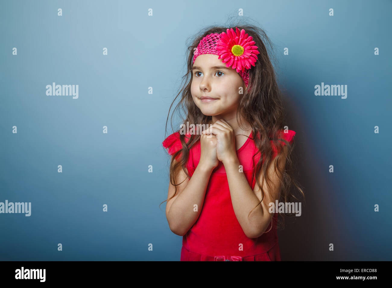 a girl of seven European appearance brunette in a bright dress f Stock ...