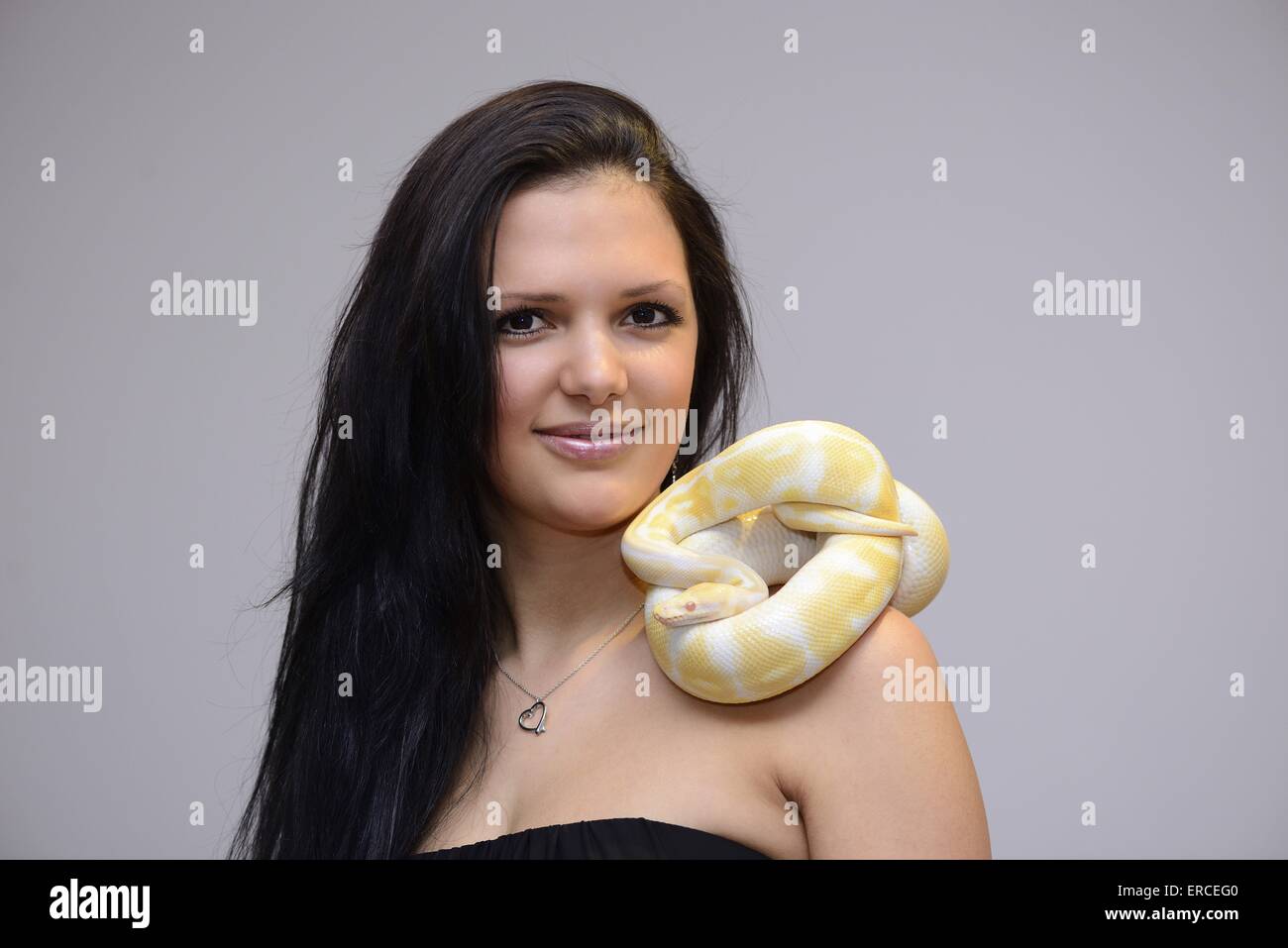 woman and Albino Burmese python Stock Photo - Alamy