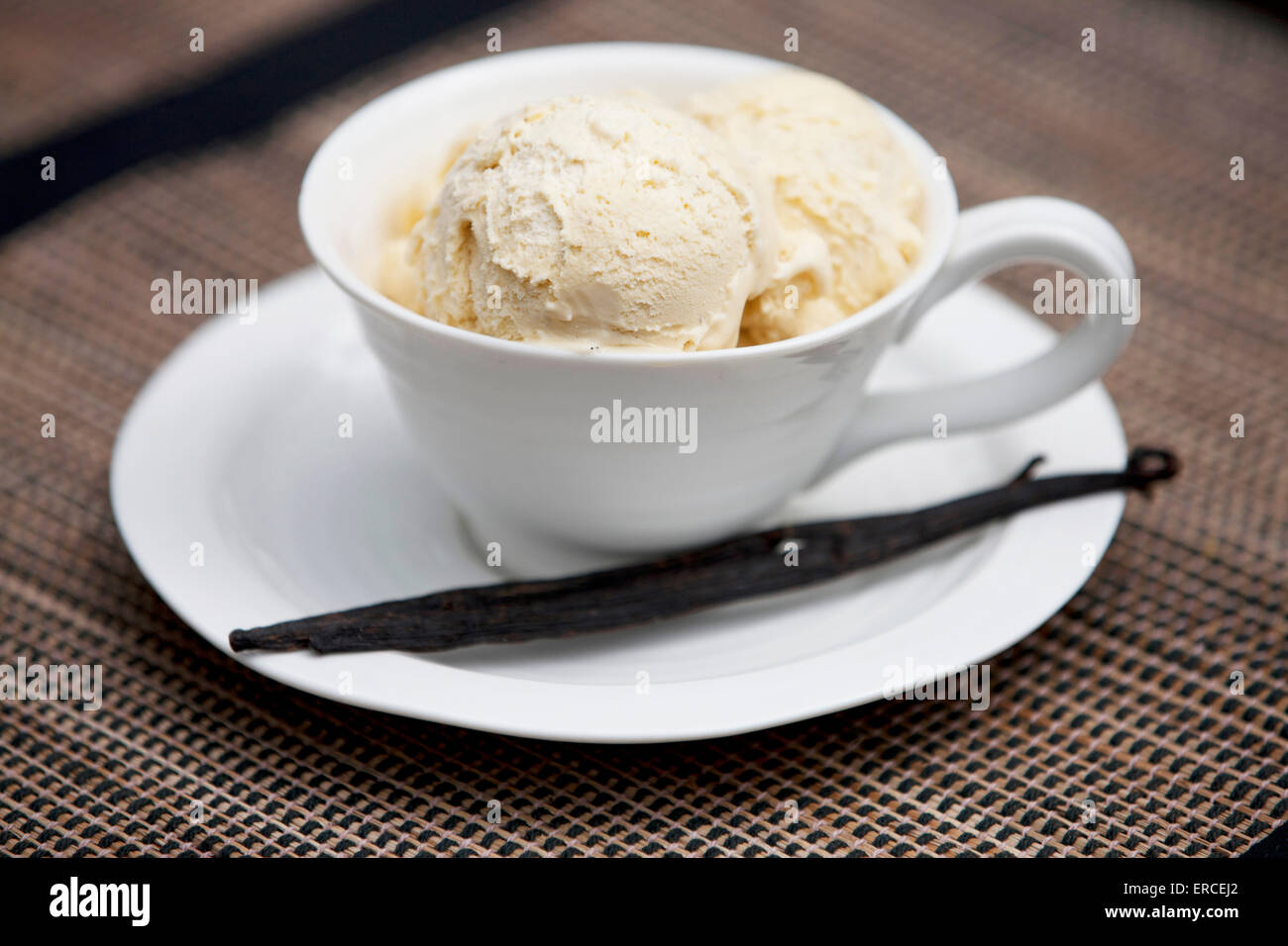 Vanilla ice cream in a cup and saucer Stock Photo - Alamy