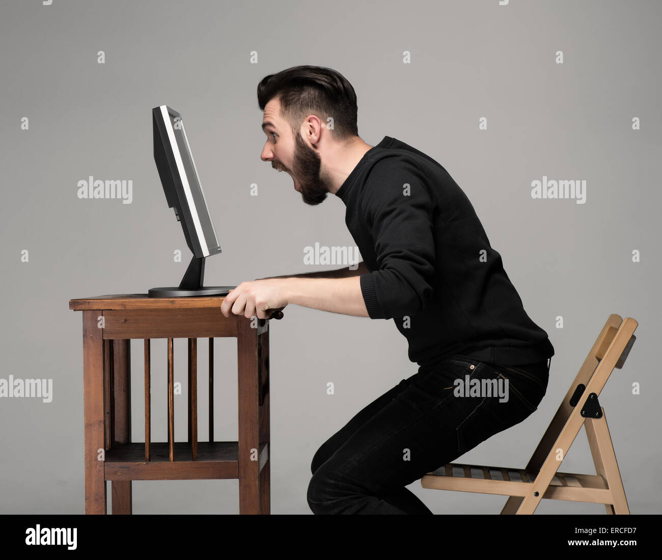 Funny and crazy man using a computer Stock Photo - Alamy