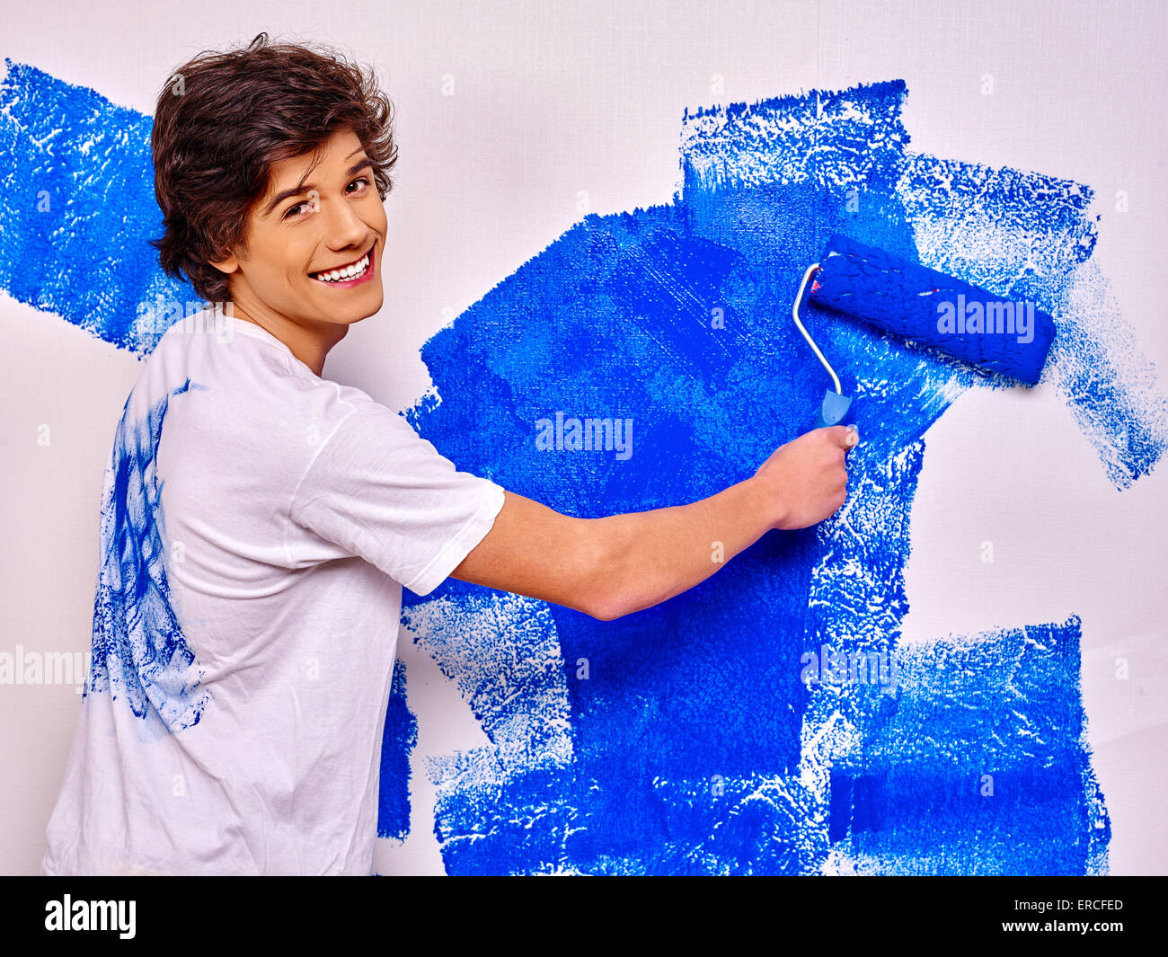 man paint wall at home Stock Photo - Alamy