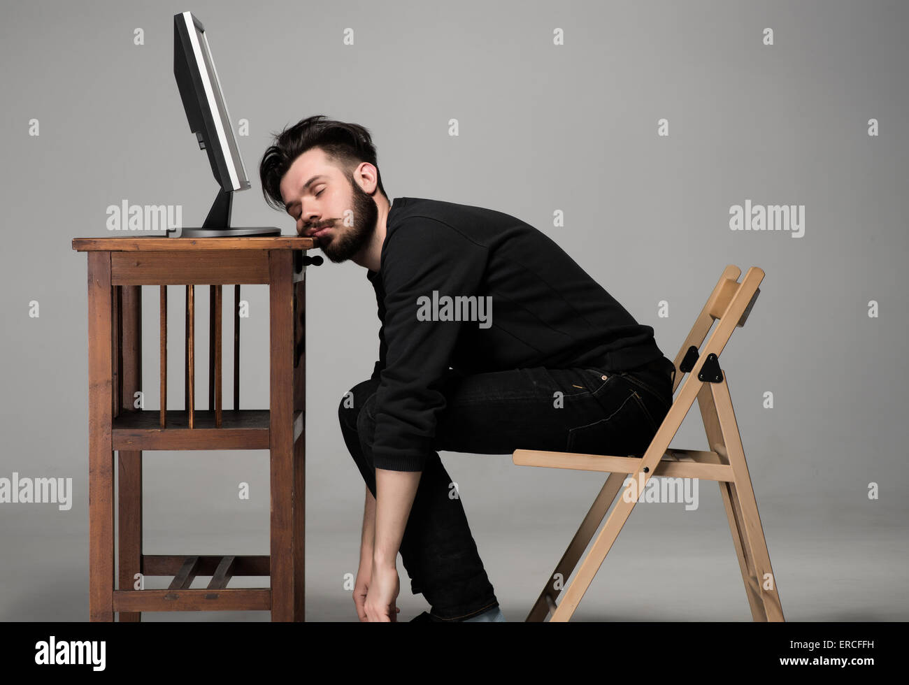 Businessman sleeping on a computer Stock Photo - Alamy