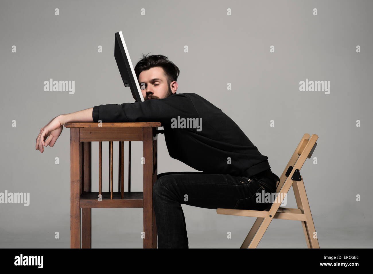 Businessman sleeping on a computer Stock Photo - Alamy