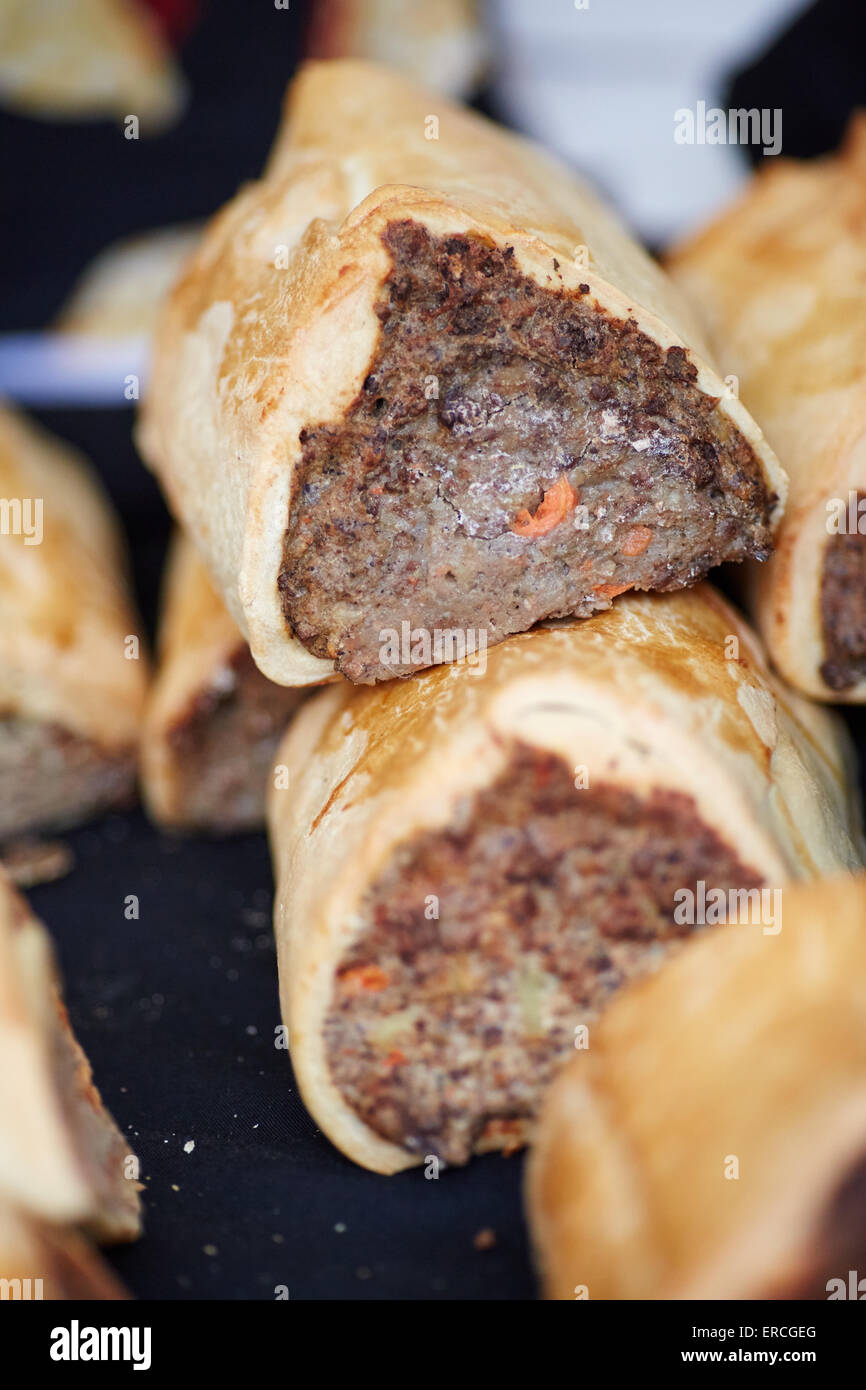 Market stall food displayed homemade thick filled meat rolls pies ...
