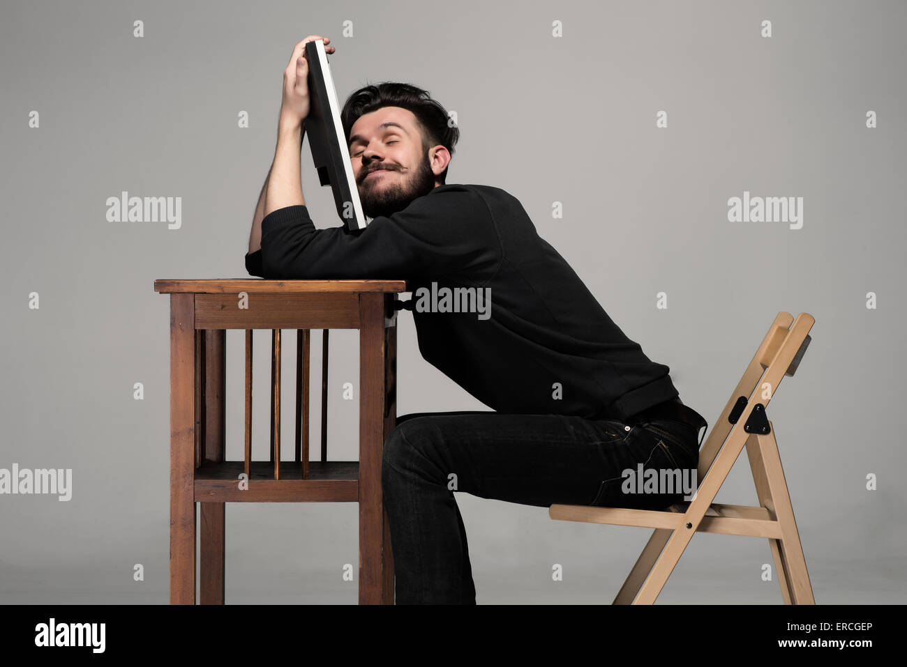 Businessman sleeping on a computer Stock Photo - Alamy