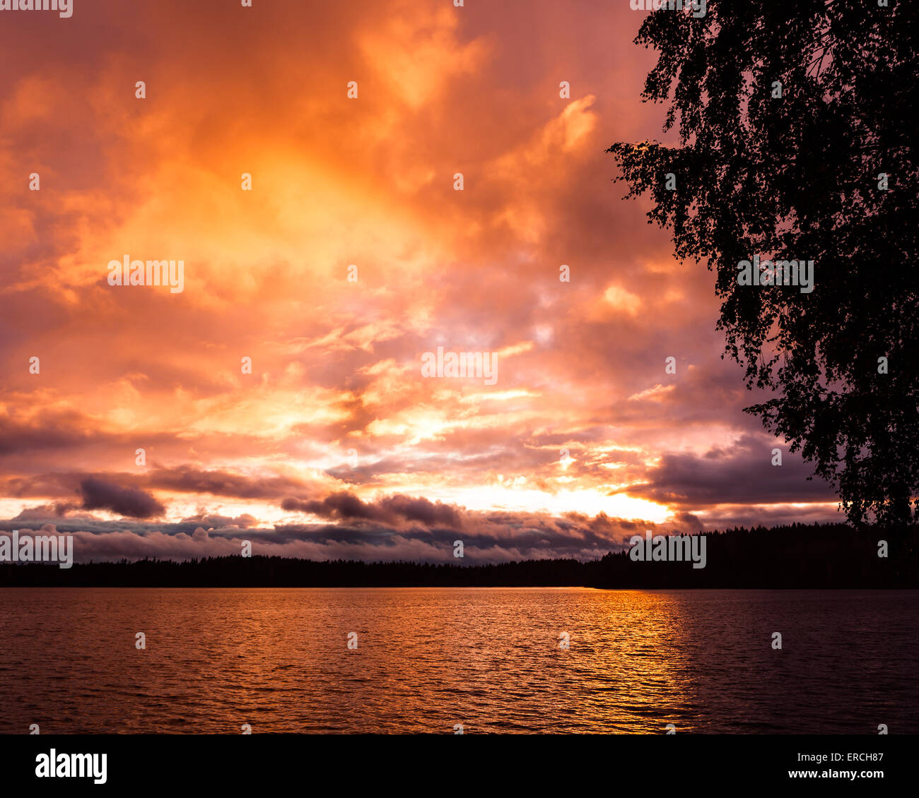 Dramatic fire red sunset over a lake Stock Photo - Alamy
