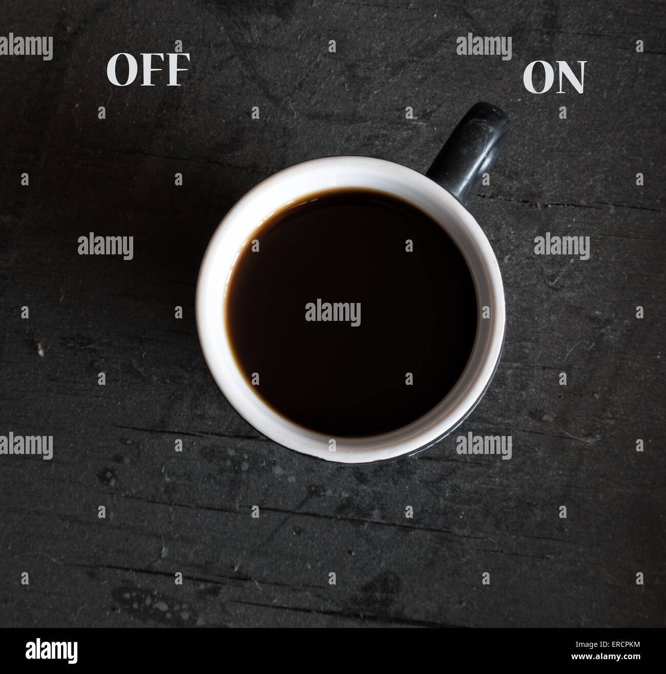 cup of coffee switching on on a dark table Stock Photo - Alamy