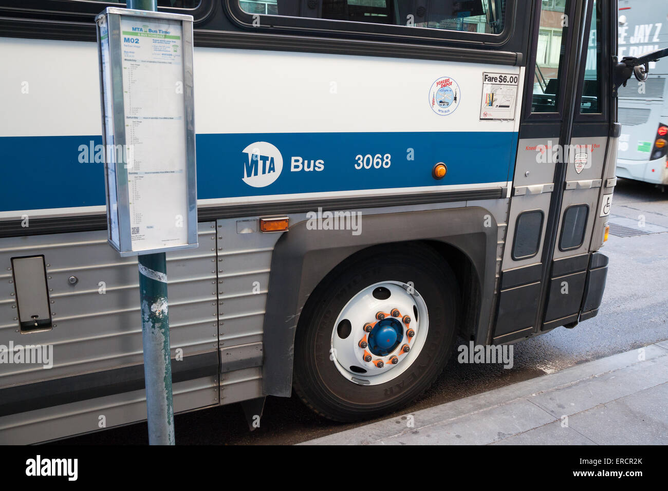 A New York Metropolitan Transit Authority bus parked at a bus stop ...