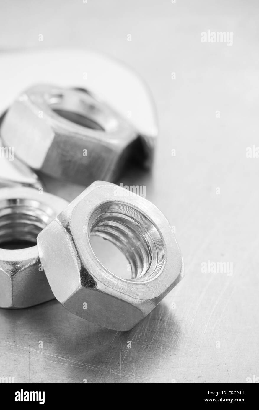 nuts tool at metal background texture Stock Photo - Alamy