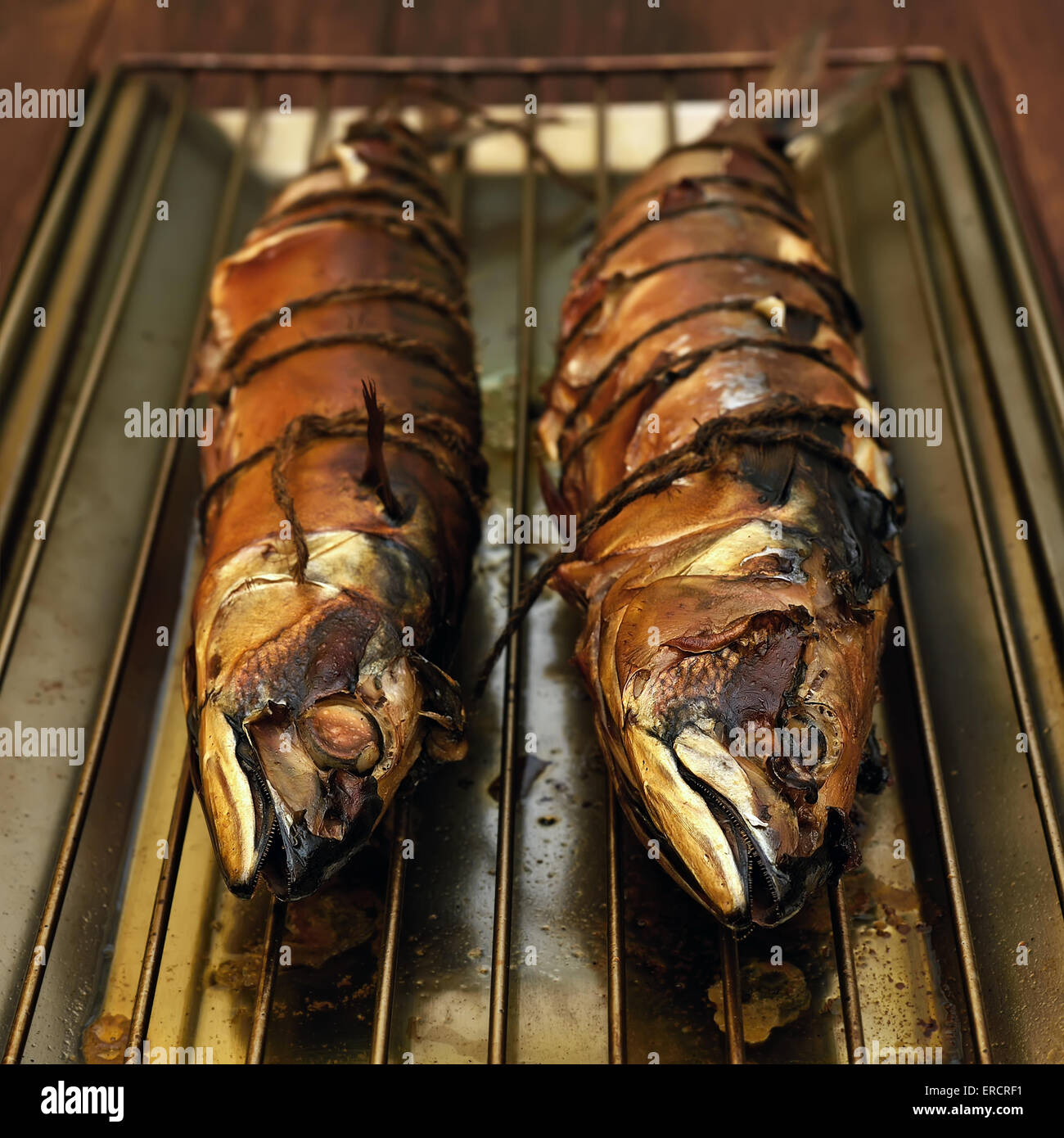 Smoke-dried mackerel fish on lattice, close up view Stock Photo - Alamy