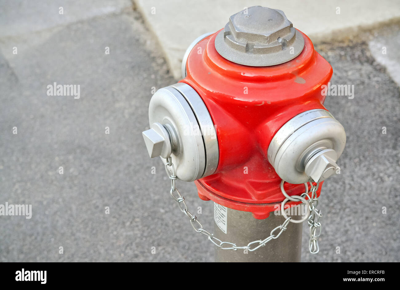 Closeup of the top part of a red fire hydrant on the sidewalk Stock ...