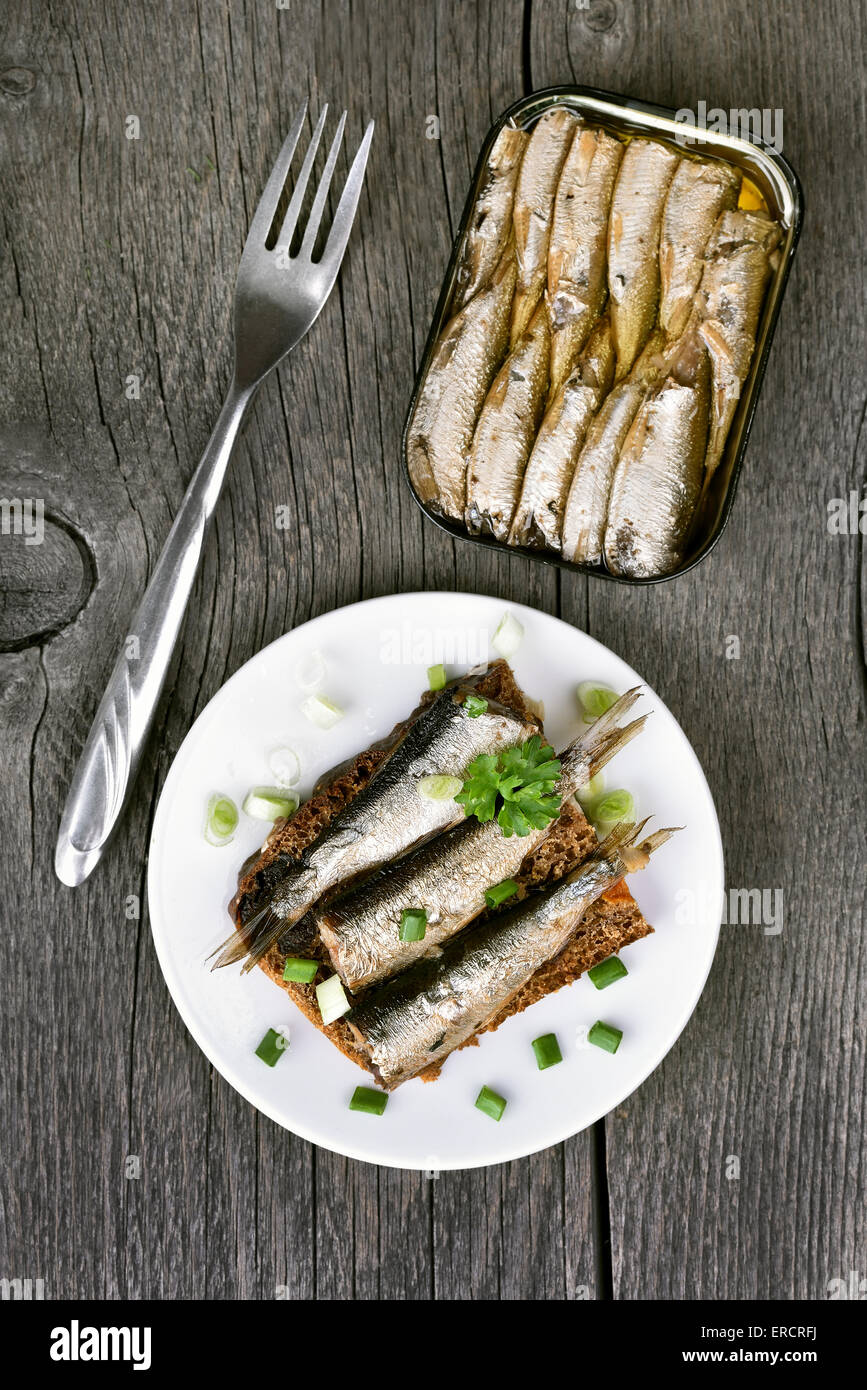 Sprats sandwich on wooden table, top view Stock Photo - Alamy