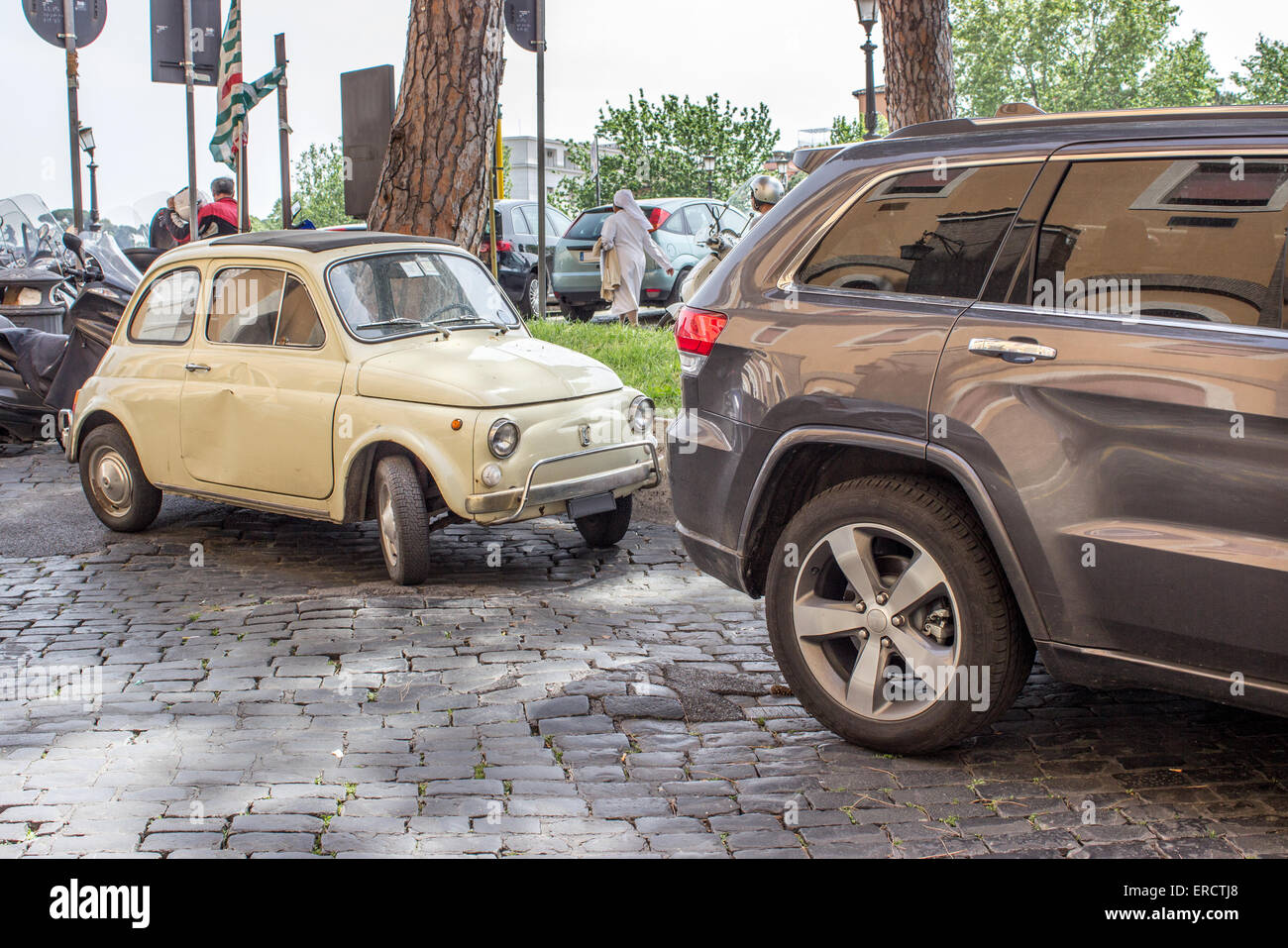 A small car behind a big SUV Stock Photo - Alamy