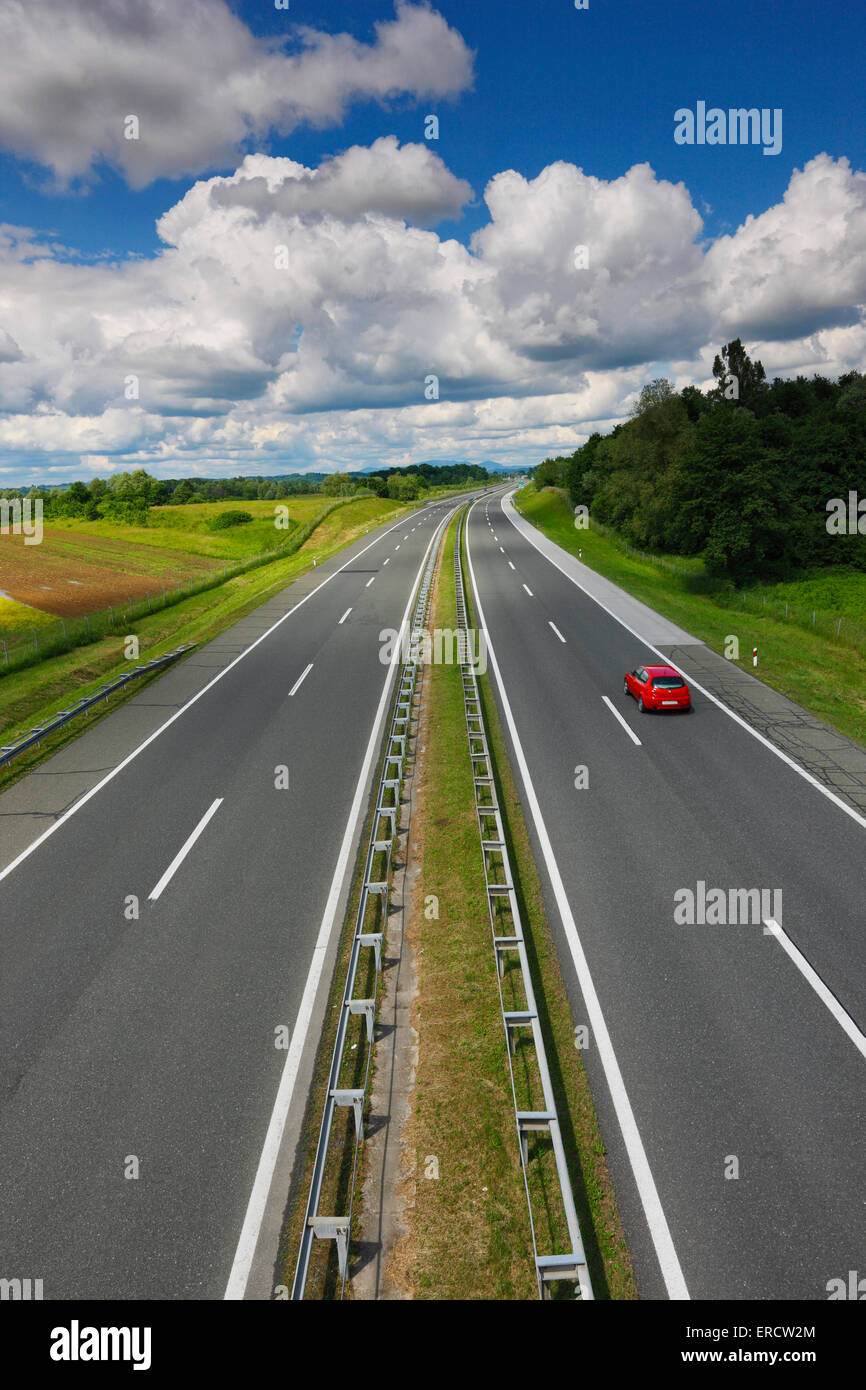 Highway and clouds in spring Stock Photo - Alamy
